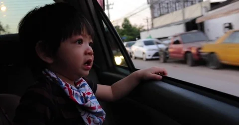 baby boy crying look out of window car d... | Stock Video | Pond5