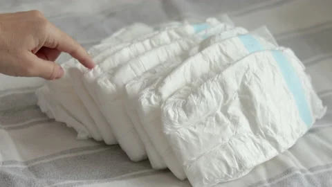 baby diapers in pack woman mother hand o... | Stock Video | Pond5