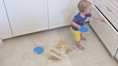 Baby exploring environment around the ho... | Stock Video | Pond5