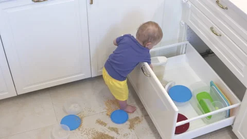 Baby exploring environment around the ho... | Stock Video | Pond5