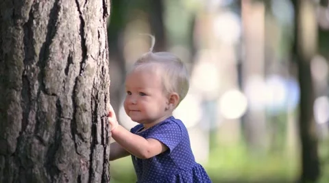 Baby girl one year old playing hide and ... | Stock Video | Pond5