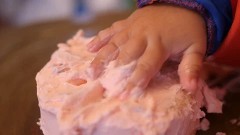 Baby makes huge mess with her birthday c... | Stock Video | Pond5