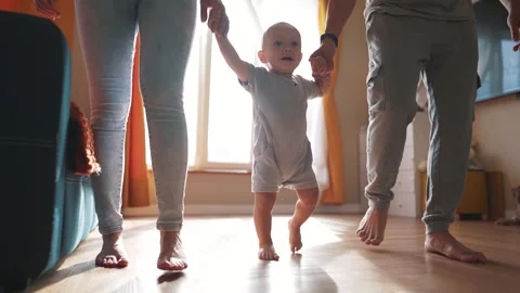 baby with parents first steps. happy fam... | Stock Video | Pond5