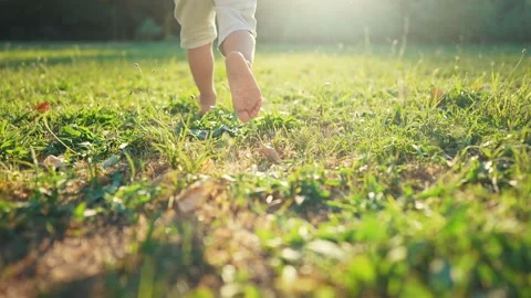 baby running in the park with bare feet.... | Stock Video | Pond5