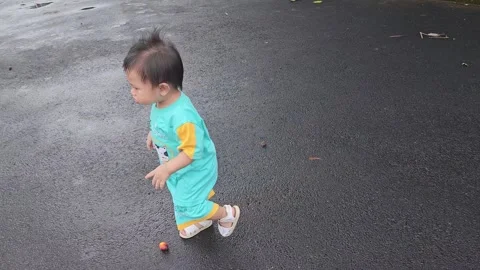 Baby running on the street with shoes. c... | Stock Video | Pond5