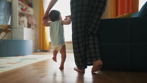 baby takes the first steps to learn. hap... | Stock Video | Pond5