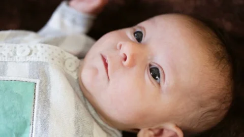 Baby's head close-up. Side view, real ti... | Stock Video | Pond5