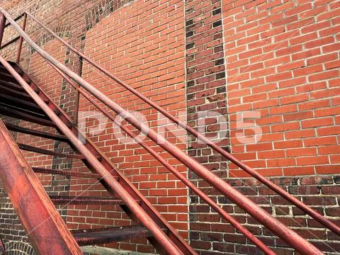 Back alley steps stairs rusting retro weathered aging brick warehouse ...