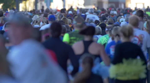 The back of a crowd of people running in... | Stock Video | Pond5