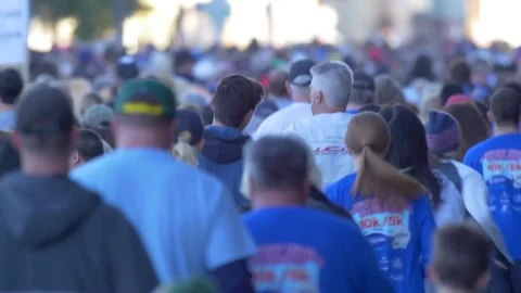 The back of a crowd of people running in... | Stock Video | Pond5