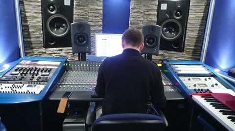 Back of man in modern recording studio w... | Stock Video | Pond5