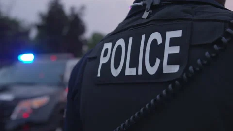 Back of Police Officer's Uniform Jacket ... | Stock Video | Pond5