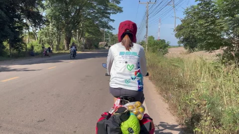 Back shot of women cycling in the street... | Stock Video | Pond5