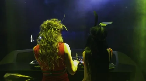 Back side of mc girl and Dj girl in mask... | Stock Video | Pond5