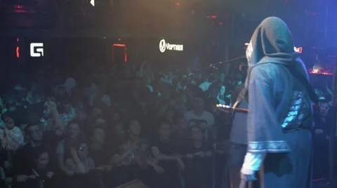 Back side of singer in mantle on stage o... | Stock Video | Pond5