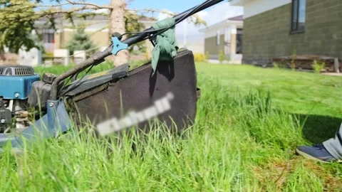 Back side view of lawnmower and unknown ... | Stock Video | Pond5
