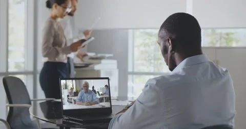 Back view of african employee sitting at... | Stock Video | Pond5