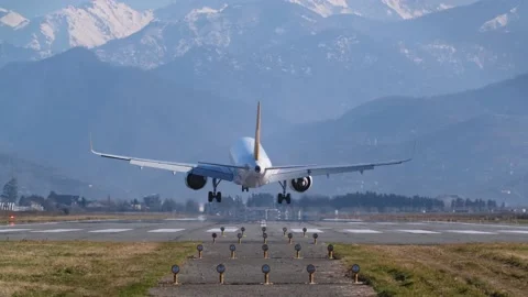 Back view airplane landing in airport, m... | Stock Video | Pond5
