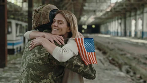 Back view of american soldier hugging wi... | Stock Video | Pond5