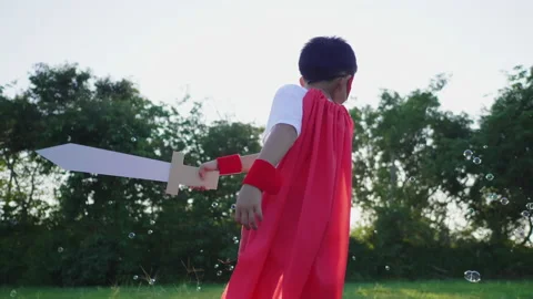 Back view of Asian boy playing sword in ... | Stock Video | Pond5