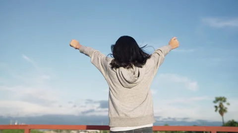 Back view of Asian girl raised up to blu... | Stock Video | Pond5