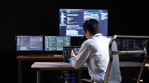 Back View Of Asian Male Programmer Looki... | Stock Video | Pond5