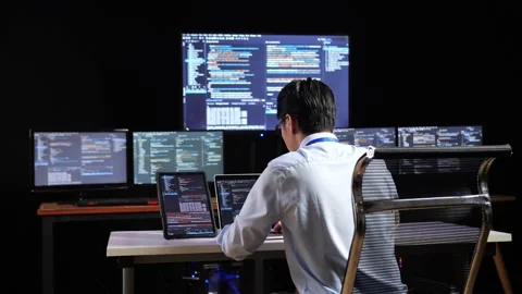 Back View Of Asian Male Programmer Looki... | Stock Video | Pond5