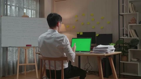 Back View Of Asian Man Talking To Green ... | Stock Video | Pond5