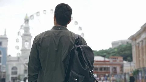 back view of bi-racial man walking to bi... | Stock Video | Pond5