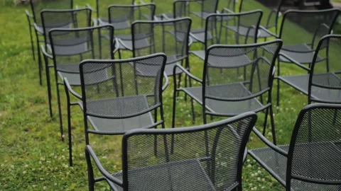 Back view of black empty chairs at the w... | Stock Video | Pond5