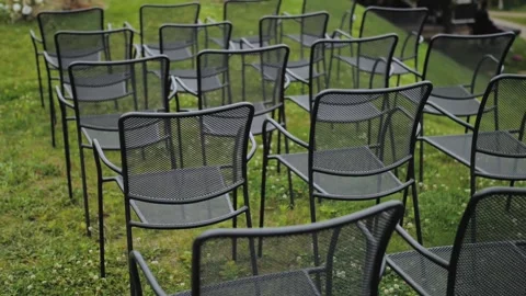 Back view of black empty chairs at the w... | Stock Video | Pond5