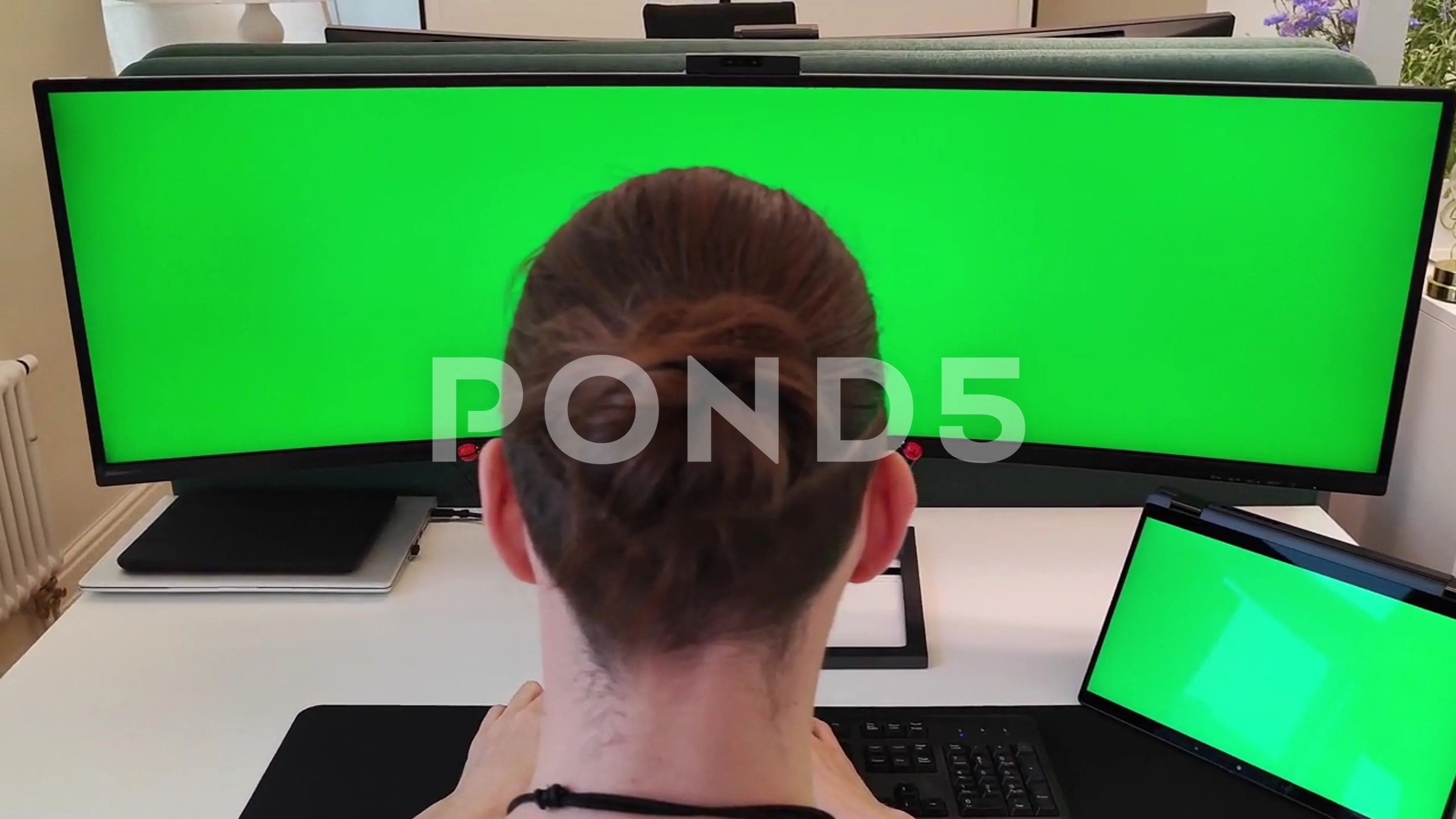 Man Working On Computer Back View