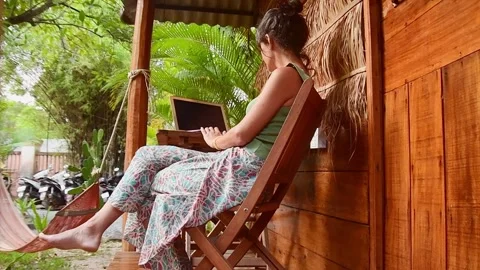 Back view caucasian hipster woman sit by... | Stock Video | Pond5