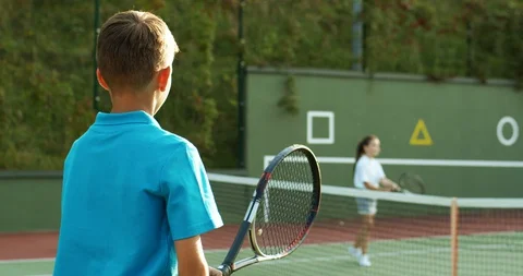 Back view of Caucasian teen boy playing ... | Stock Video | Pond5