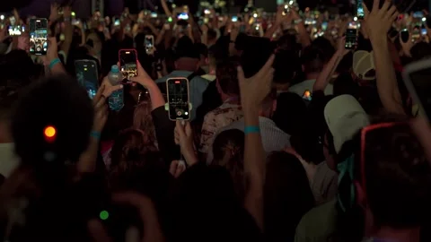 Back view of a crowd of people at an out... | Stock Video | Pond5