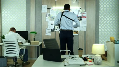 Back view of detective thinking in front... | Stock Video | Pond5