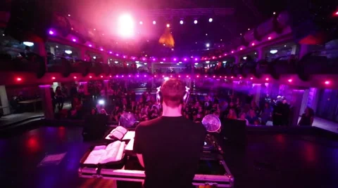 Back view of DJ is standing behind turnt... | Stock Video | Pond5