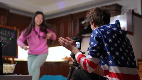 Back view excited boy clapping filming v... | Stock Video | Pond5