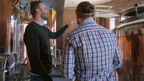 Back view excited brewer standing with c... | Stock Video | Pond5