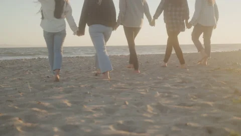Back View of Friends at the Beach Walkin... | Stock Video | Pond5