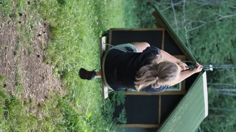 Back view of a girl jumping on a rope sw... | Stock Video | Pond5