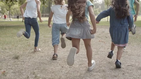 Back view of happy children competing in... | Stock Video | Pond5