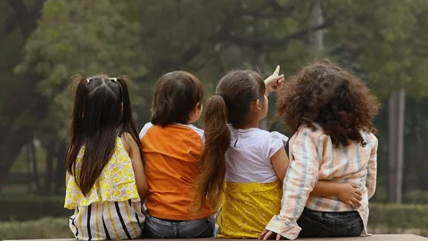 Kids Sitting Back Stock Video Footage | Royalty Free Kids Sitting Back ...