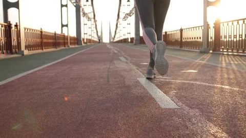 Back view legs of runner female on bridg... | Stock Video | Pond5