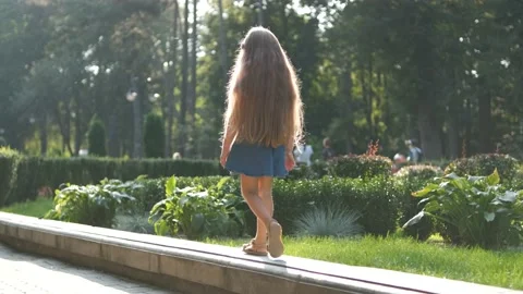 Back view of a little pretty child girl ... | Stock Video | Pond5
