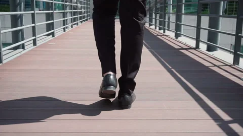 Back view of male legs in black shoes cr... | Stock Video | Pond5
