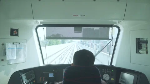 Back view of male train driver sitting i... | Stock Video | Pond5