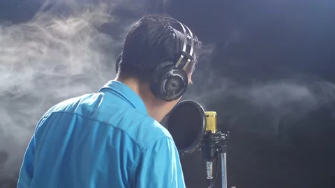 Back View Of A Man With Headphone Singin... | Stock Video | Pond5