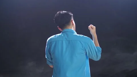 Back View Of A Man Holding A Microphone ... | Stock Video | Pond5