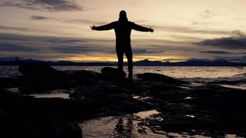 Back View Of A Man Raising His Arms Whil... | Stock Video | Pond5